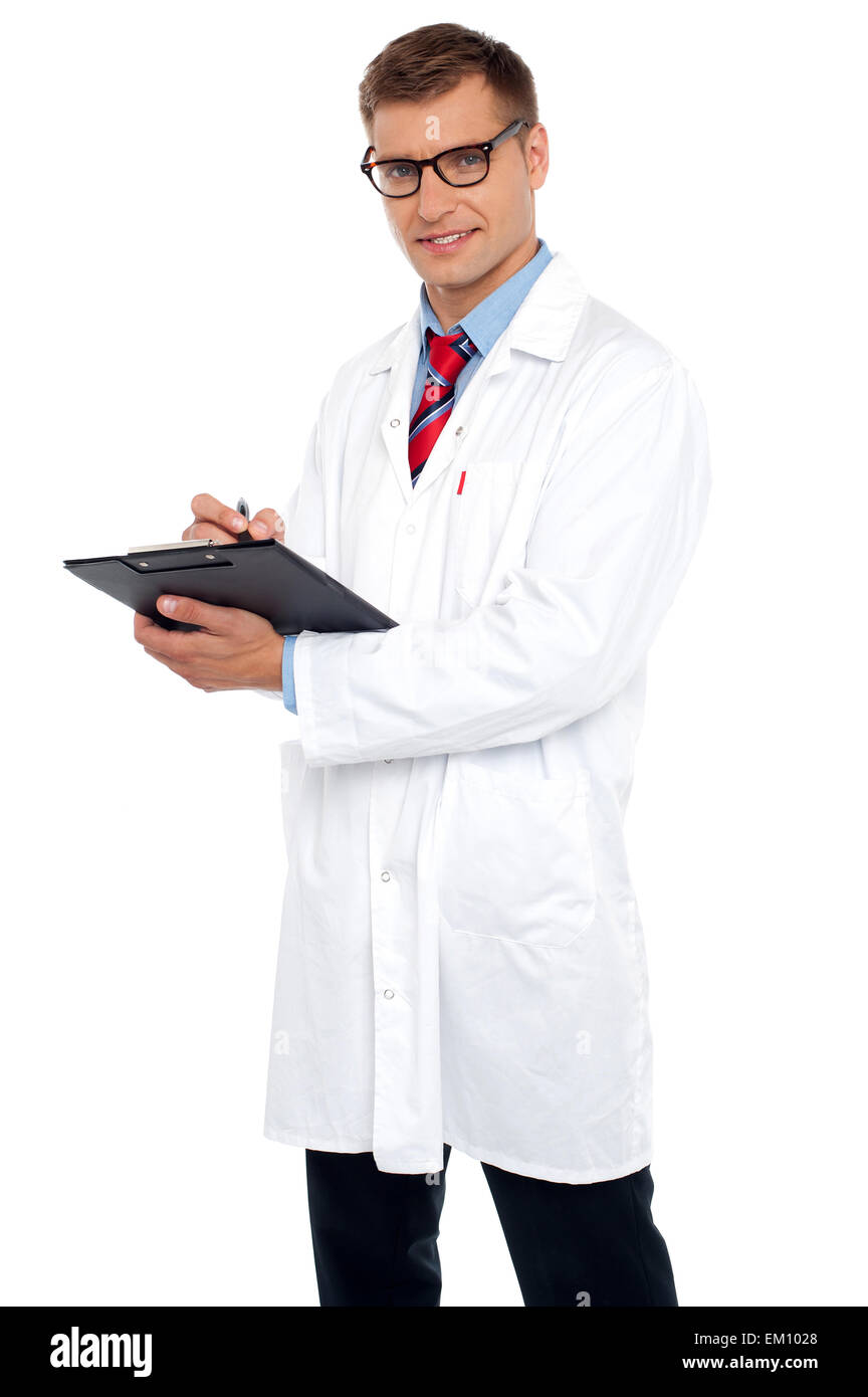 Handsome doctor writing prescription Stock Photo - Alamy