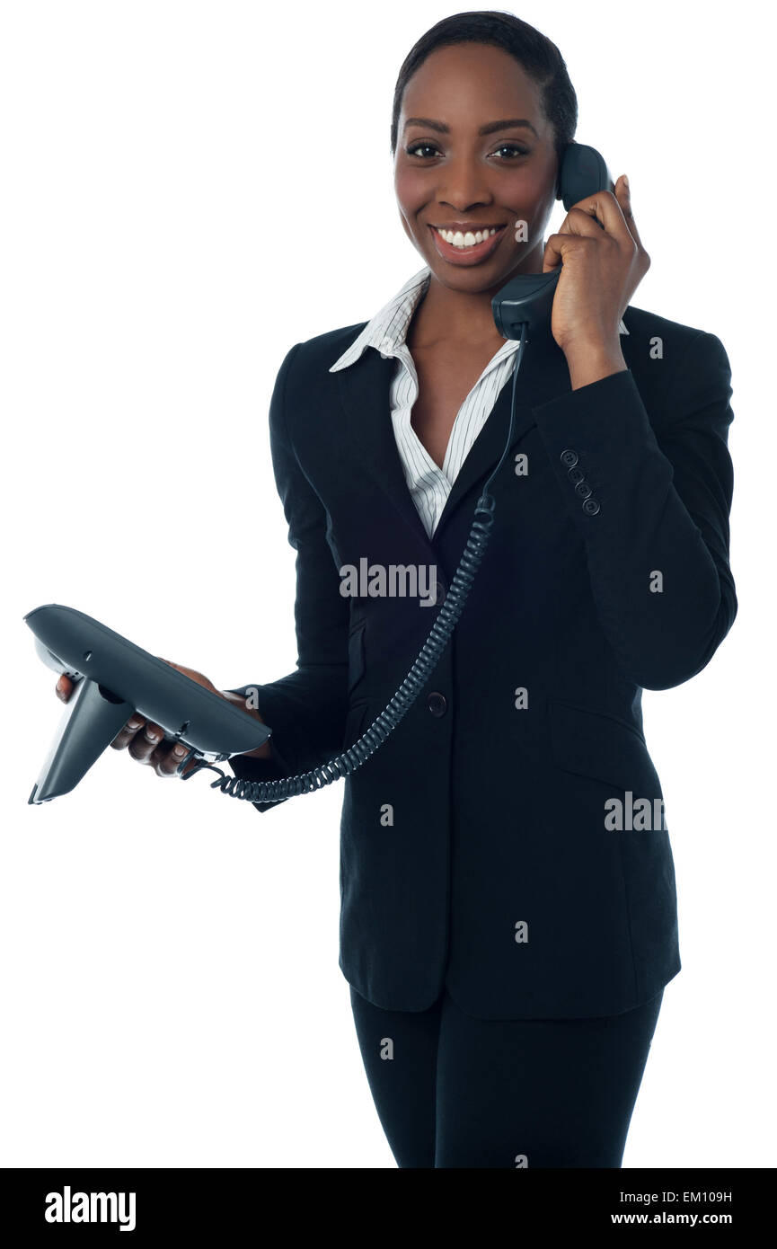 Cheerful lady attending clients call Stock Photo - Alamy