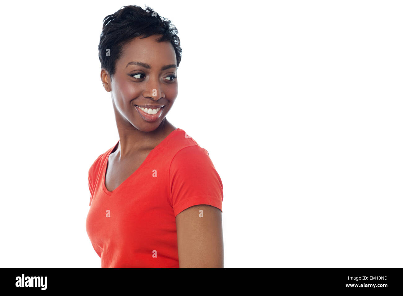 Smiling african woman looking back Stock Photo - Alamy
