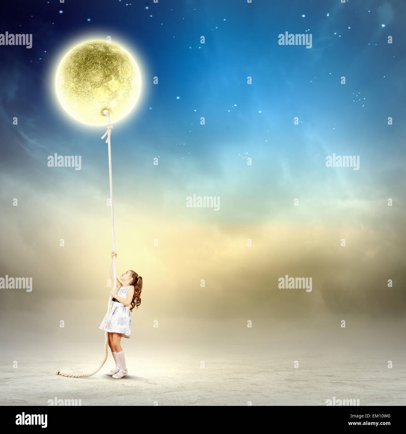 Little girl pulling moon Stock Photo - Alamy