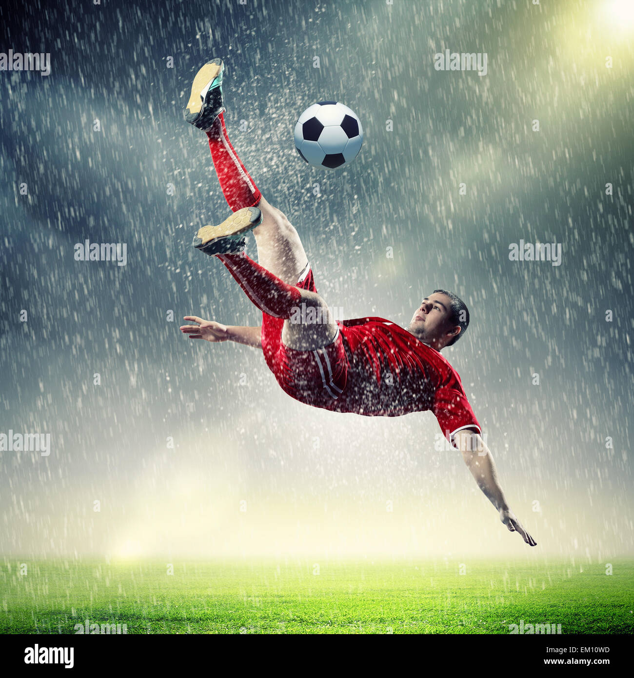 football player striking the ball Stock Photo - Alamy