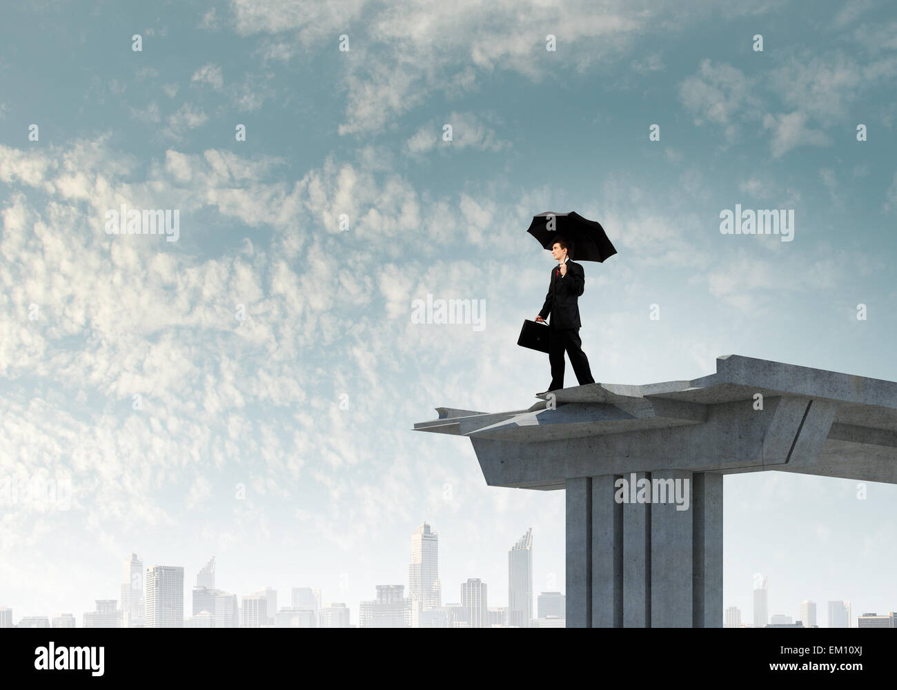 Businessman standing on bridge Stock Photo - Alamy
