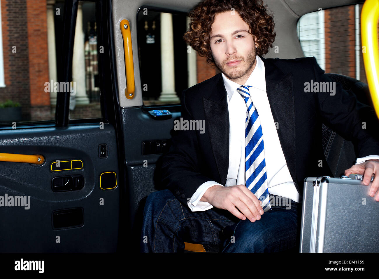 Handsome business corporate inside taxi cab Stock Photo - Alamy