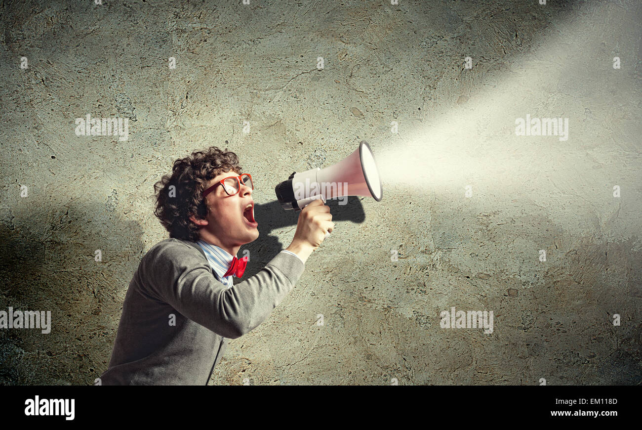 Young man with megaphone Stock Photo - Alamy
