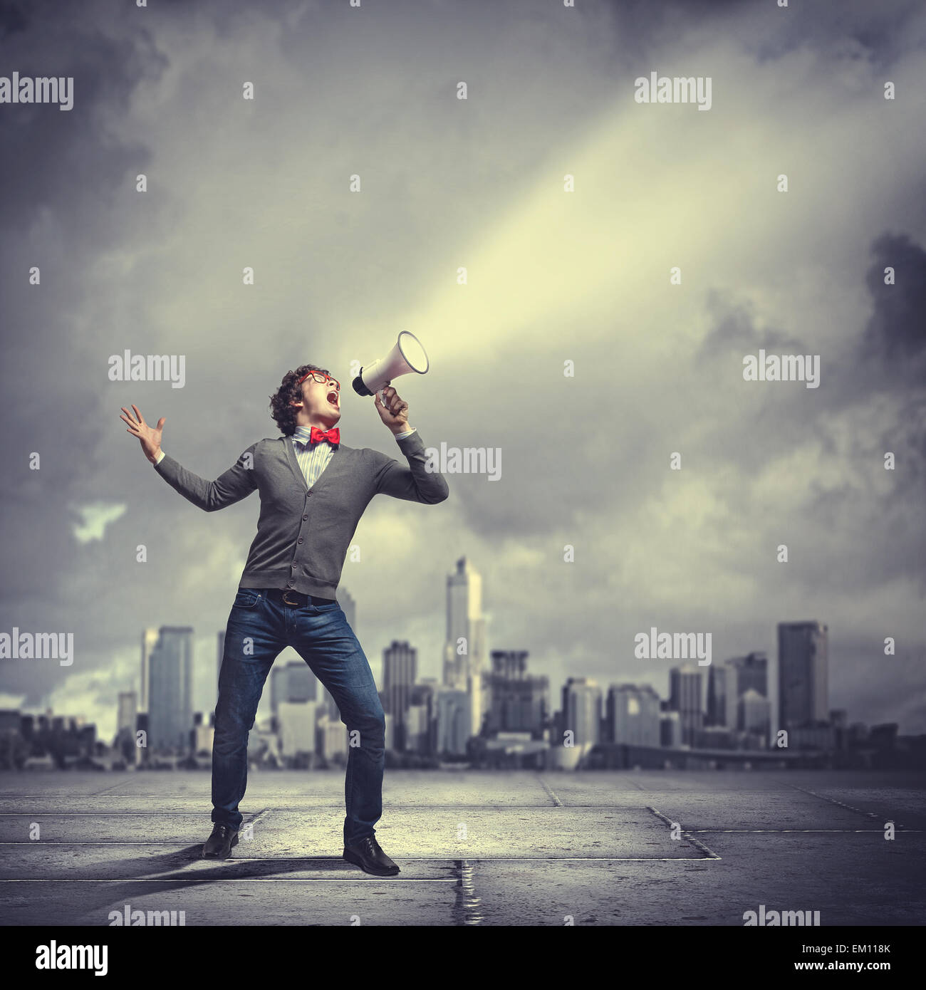 Young man with megaphone Stock Photo - Alamy