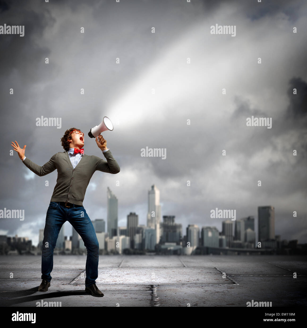 Young man with megaphone Stock Photo - Alamy