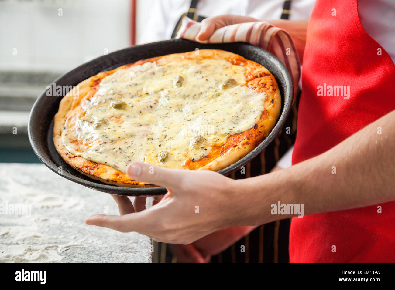 Detail woman chef holding pizza hi-res stock photography and images - Alamy
