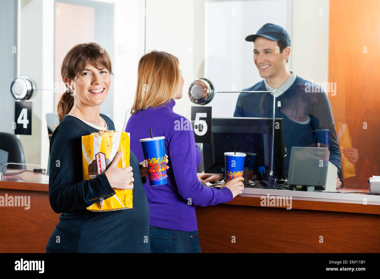 People buying movie tickets box hi-res stock photography and images - Alamy