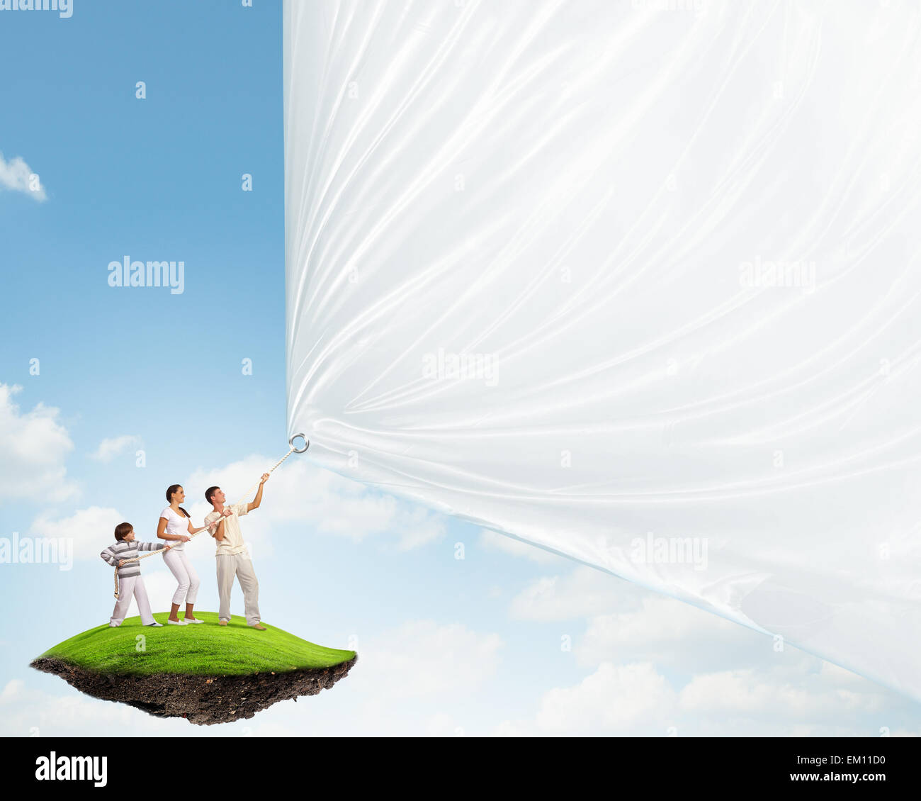 Young family pulling banner Stock Photo - Alamy