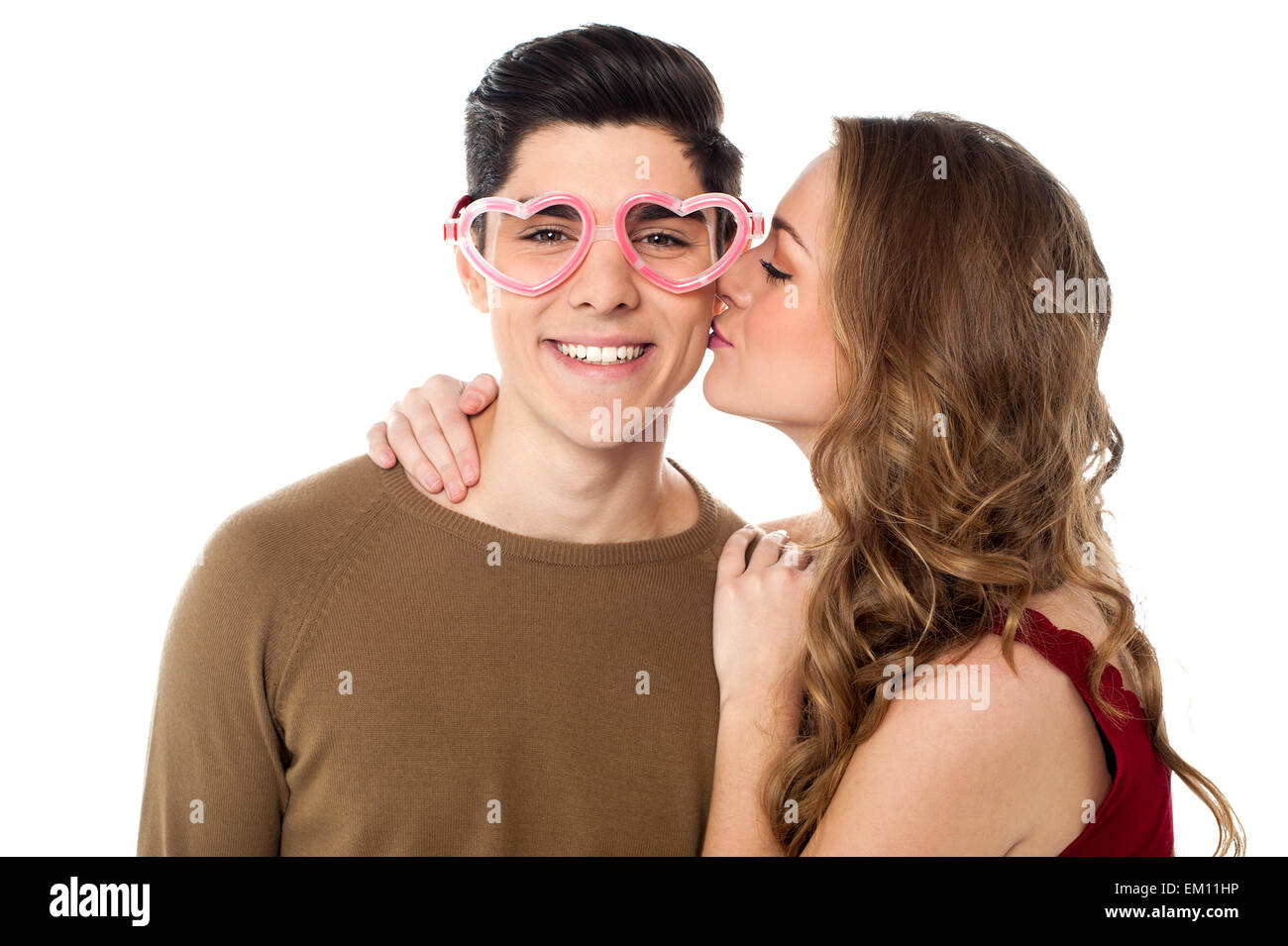 Girl kissing her boyfriend Stock Photo - Alamy