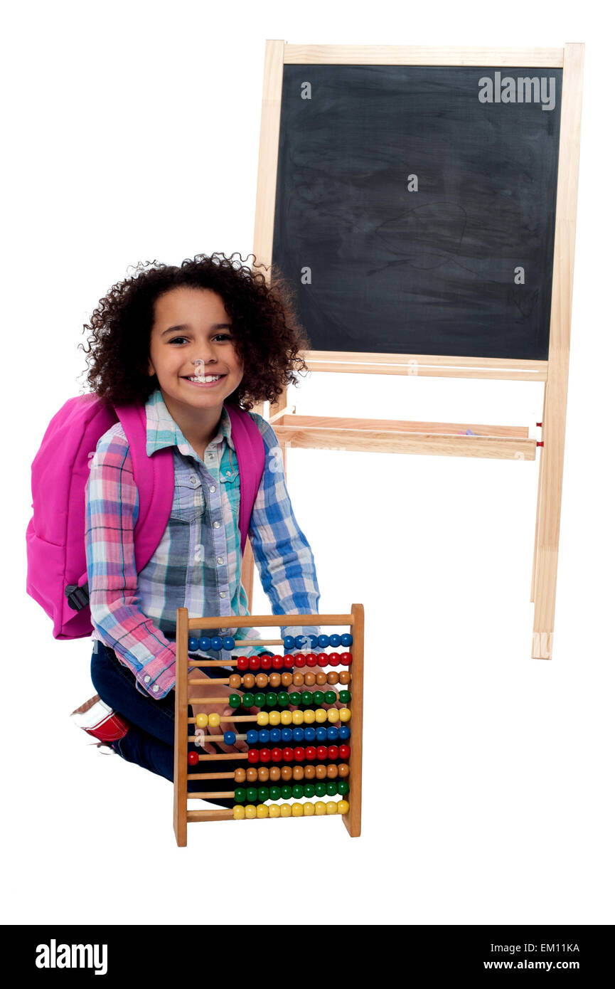 Happy school girl with abacus and pink backpack Stock Photo - Alamy