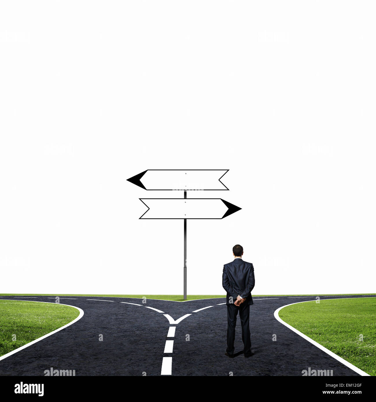 Businessman at crossroads Stock Photo - Alamy