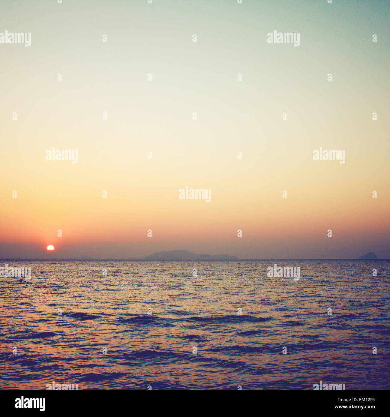 sunrise over the sea with retro filter effect Stock Photo - Alamy