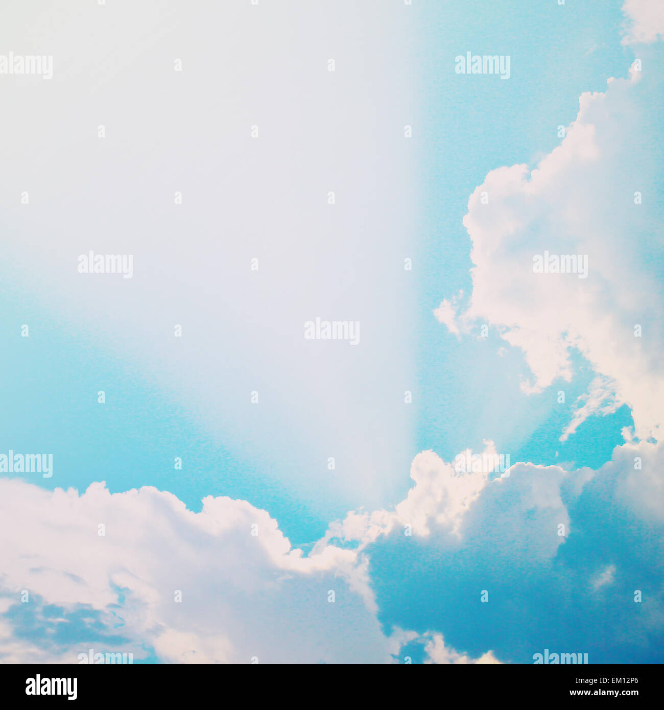 Dramatic blue sky with clouds and sunbeams, retro filter effect Stock ...