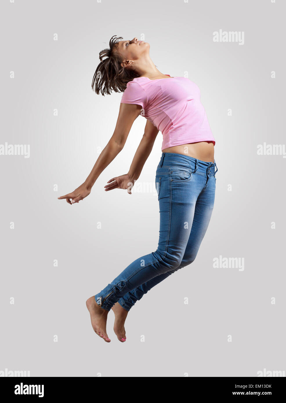 young woman dancing and jumping Stock Photo - Alamy