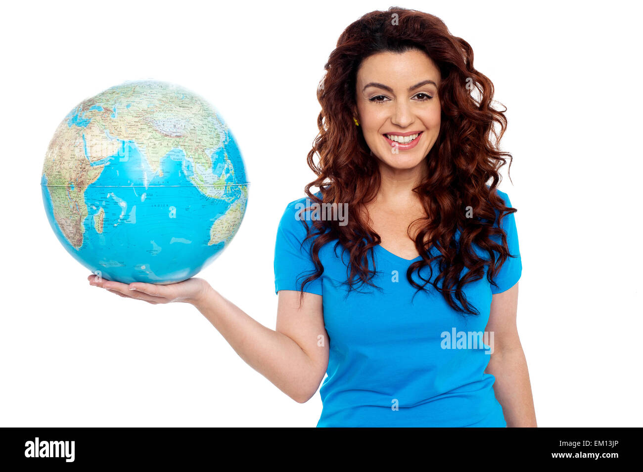 Pretty smiling girl holding globe in right hand Stock Photo - Alamy