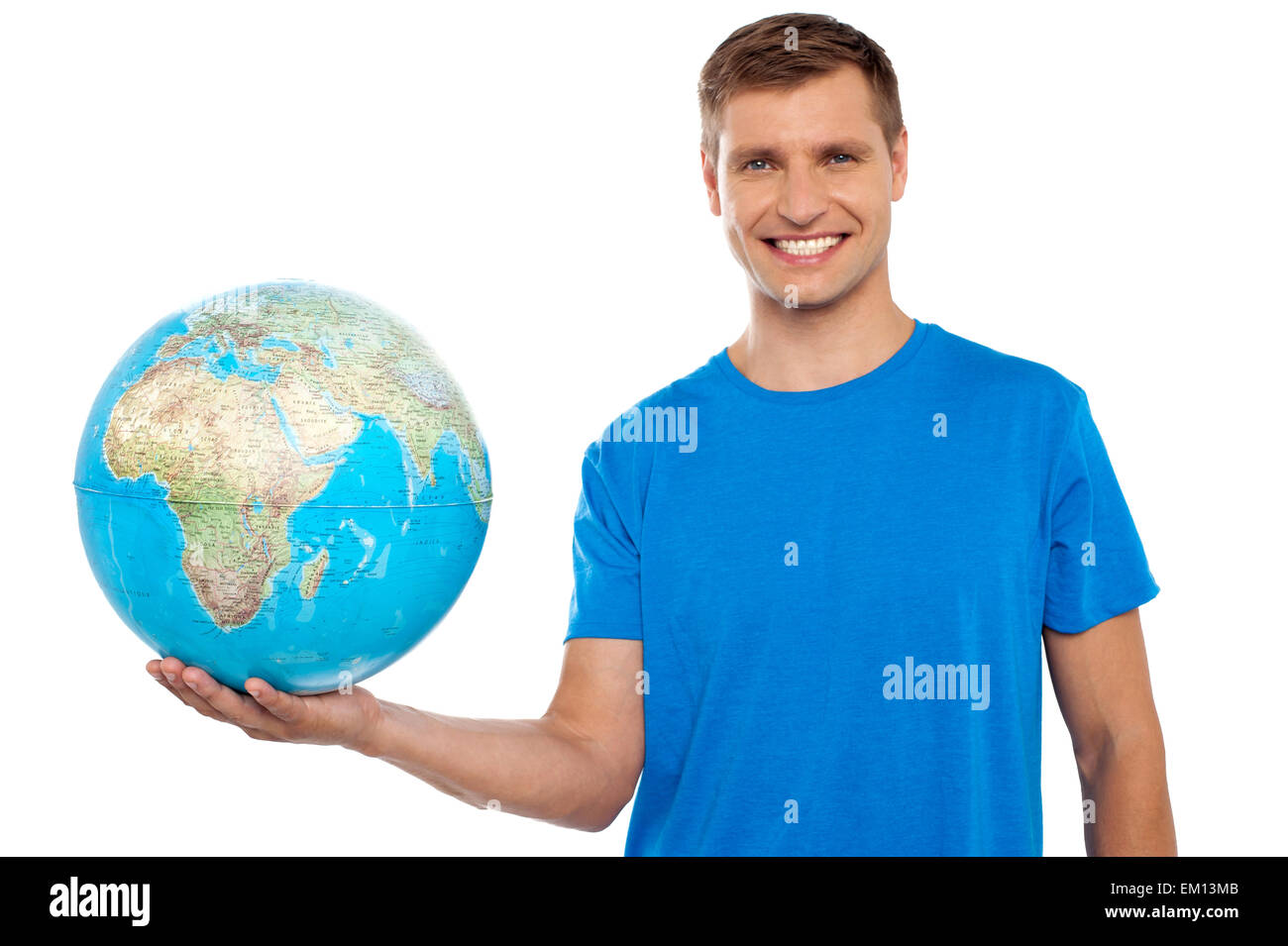 Attractive young man holding globe in his hand Stock Photo - Alamy