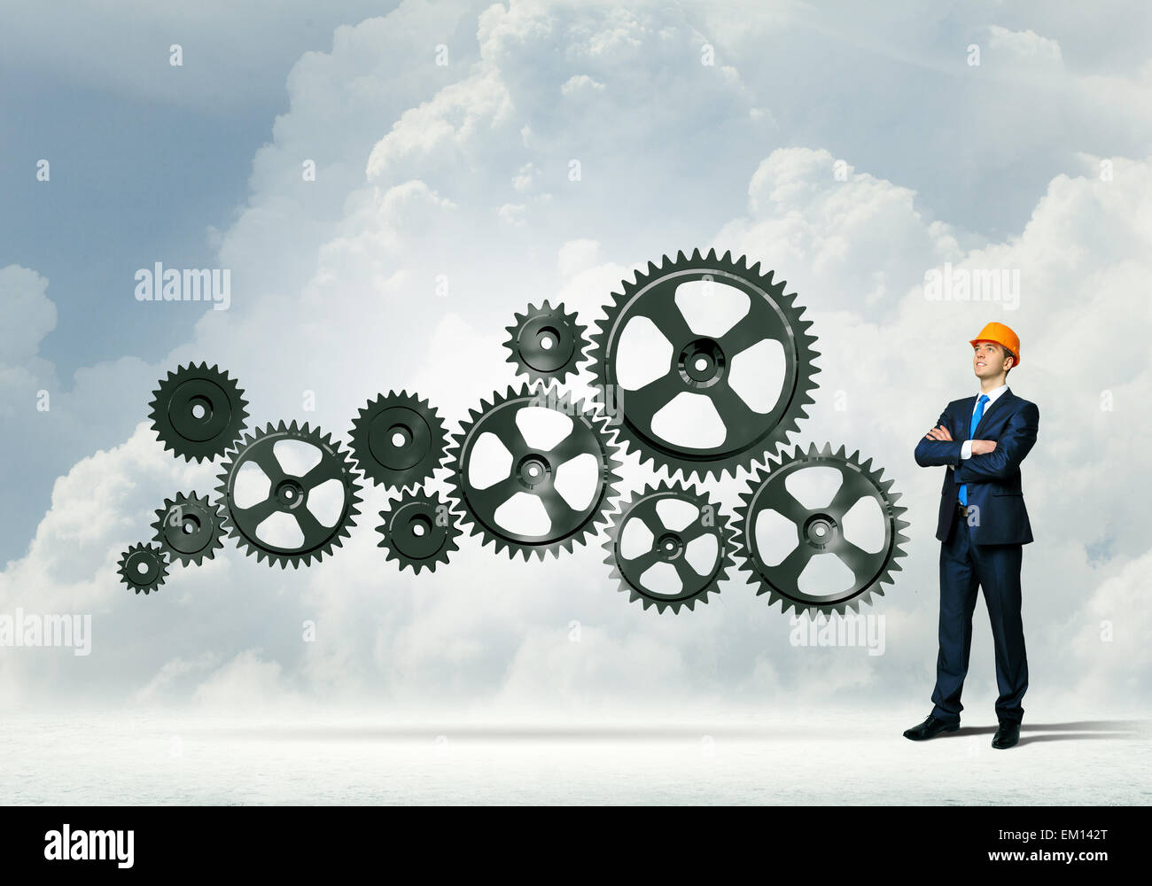 Businessman and mechanism elements Stock Photo - Alamy