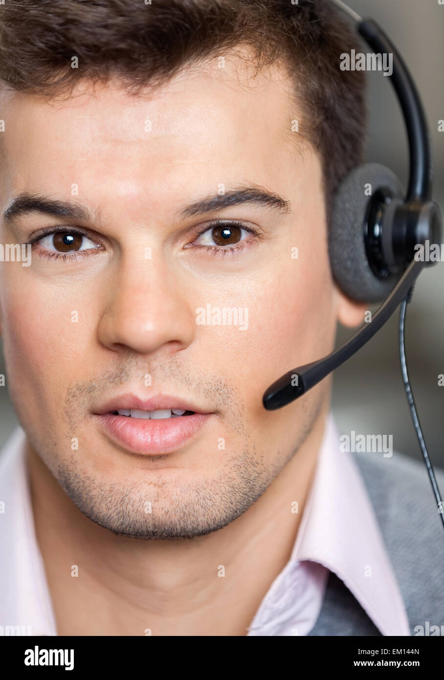 Call Center Employee Wearing Headset In Office Stock Photo - Alamy