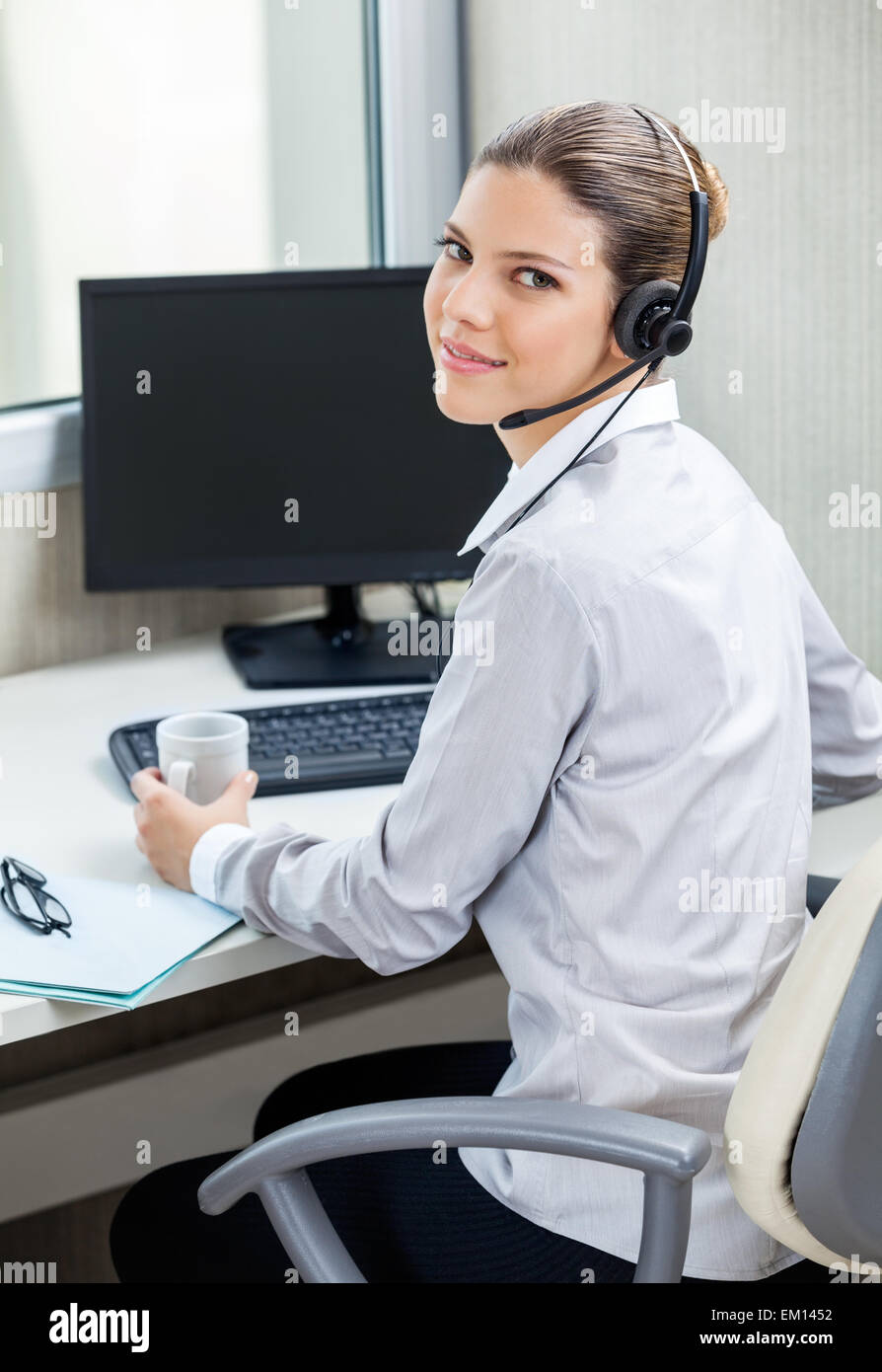 Customer Service Agent At Computer Desk Stock Photo - Alamy