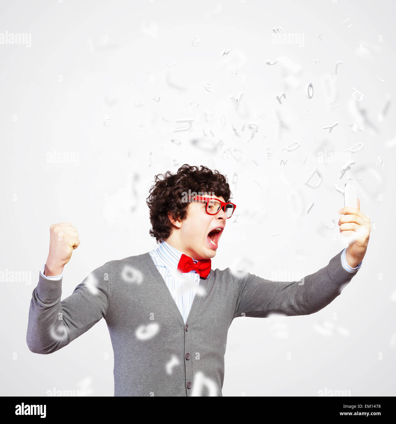 Young man shouting at his mobile phone Stock Photo - Alamy