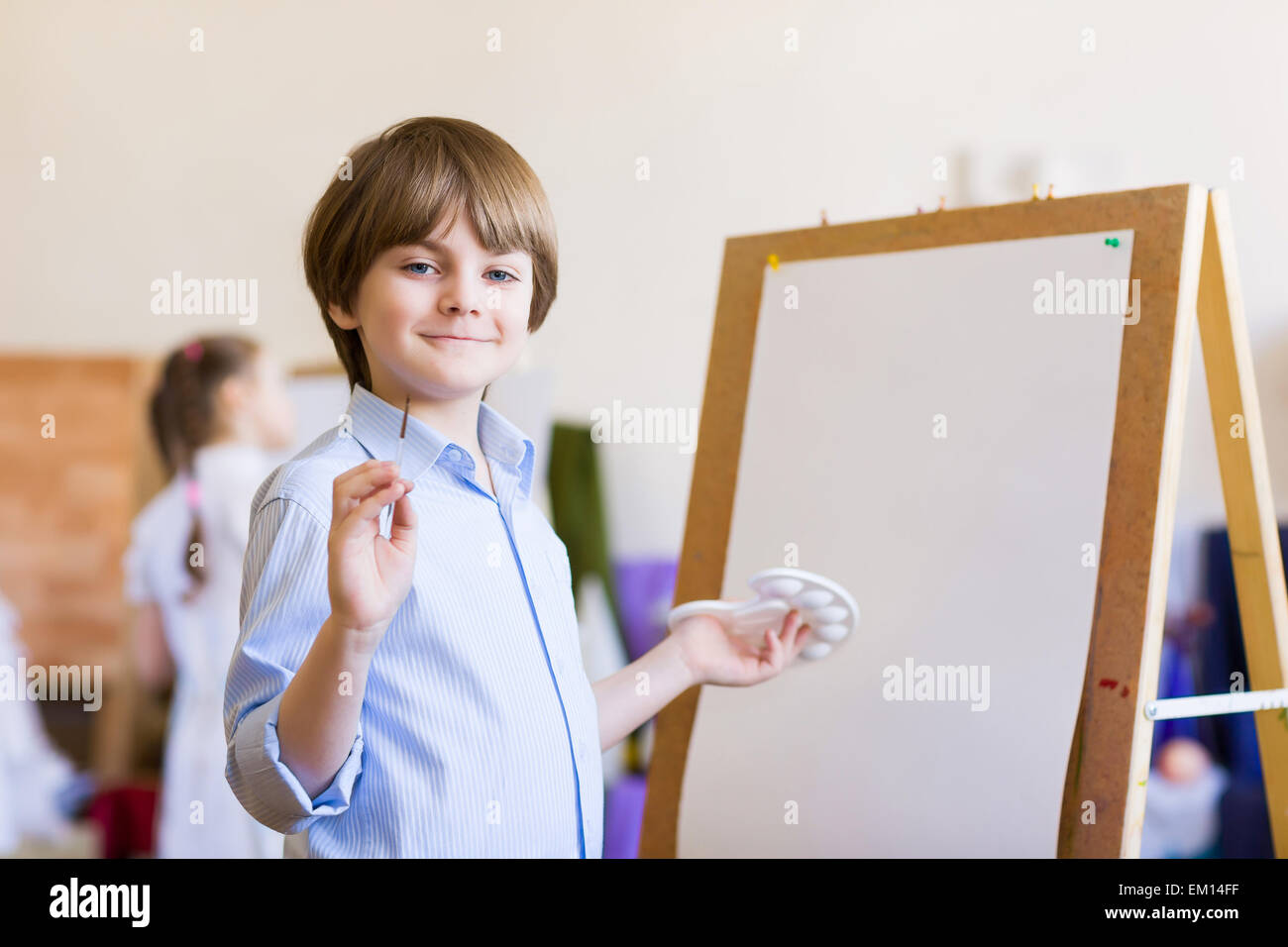 Cute boy painting Stock Photo - Alamy