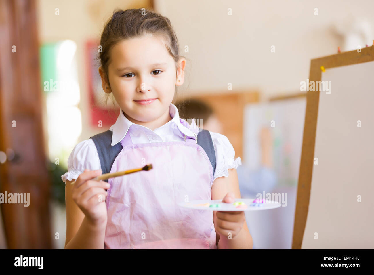 Cute girl painting Stock Photo - Alamy