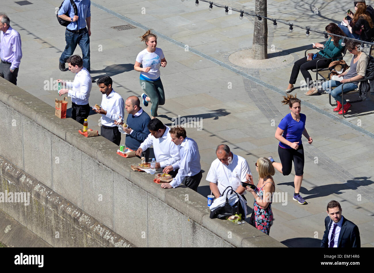 London, England, UK. City workers eating lunch outside by the River ...