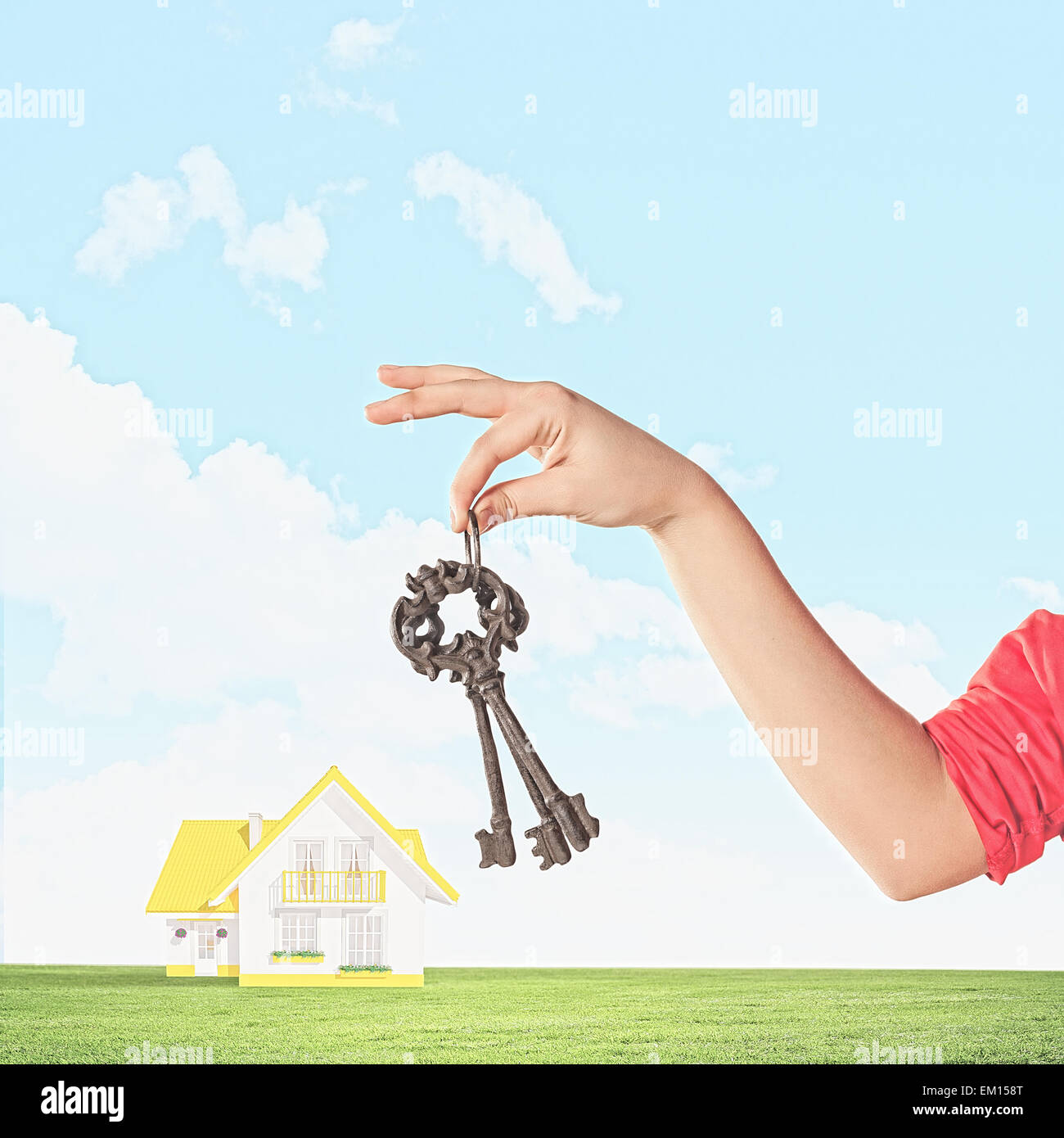Hand holding keys Stock Photo - Alamy