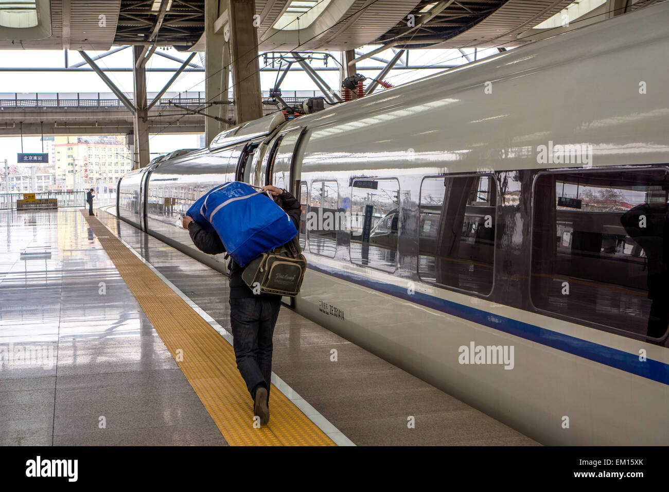 Waiting to catch a train hi-res stock photography and images - Alamy