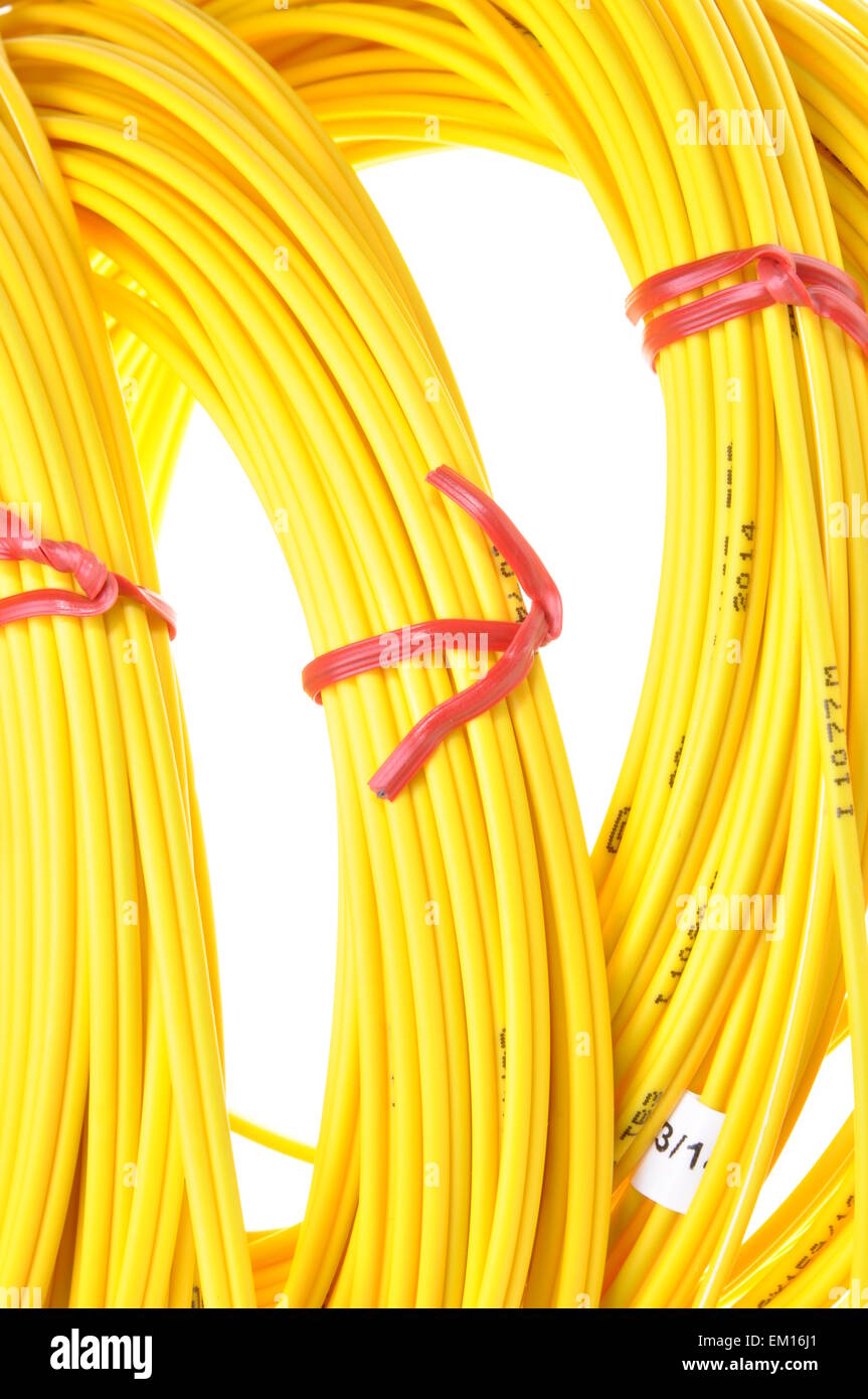 Yellow fiber optic cables isolated on white background Stock Photo - Alamy