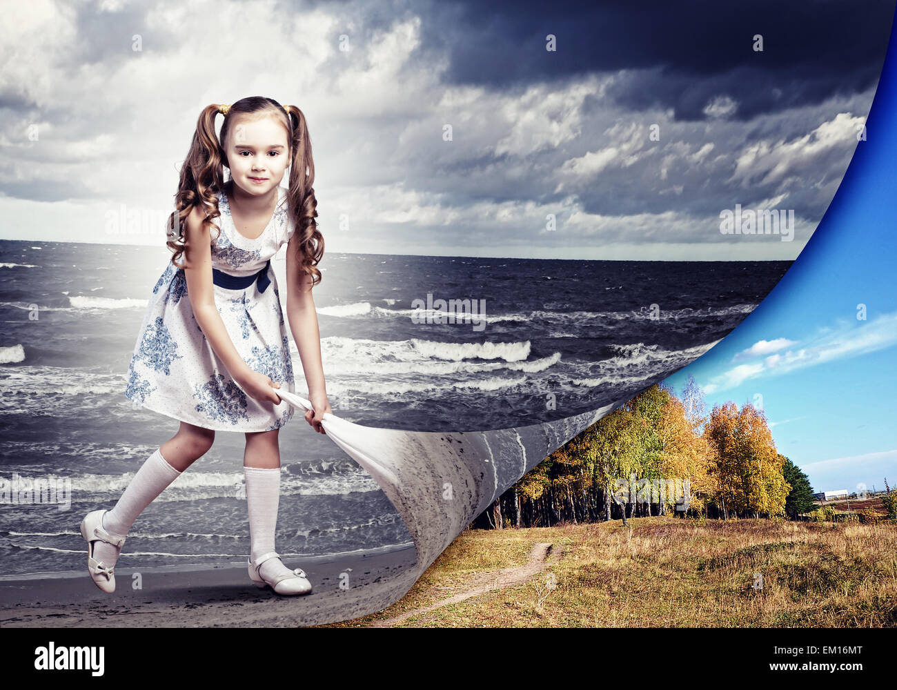 Little girl turning page Stock Photo - Alamy