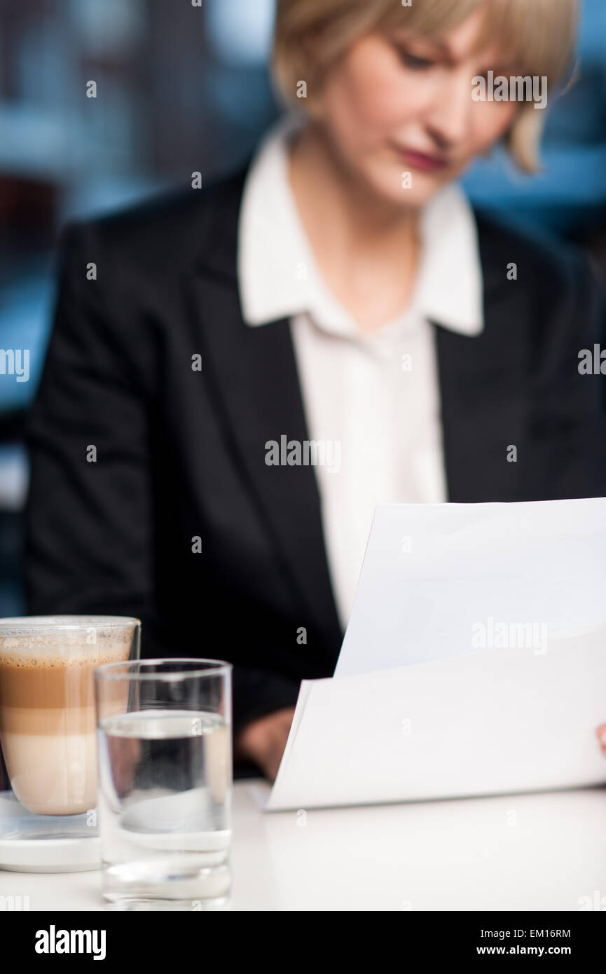 Blur image of business lady in background Stock Photo - Alamy