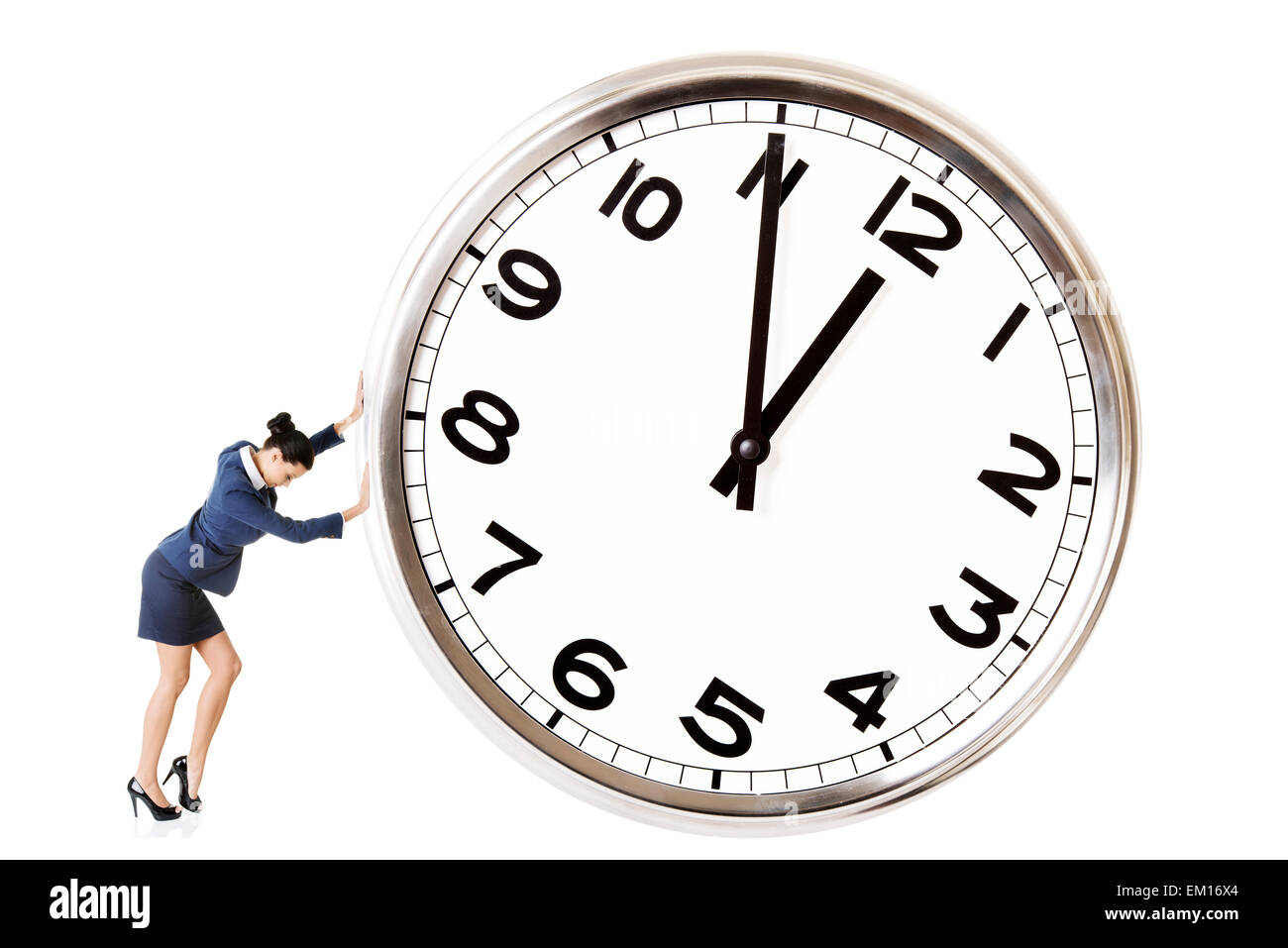 Businesswoman is pushing a big clock Stock Photo - Alamy
