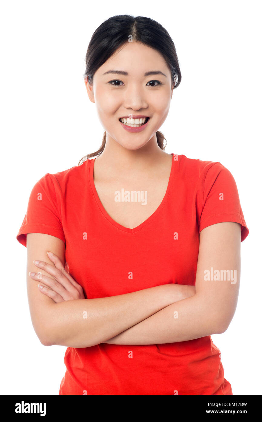 Casual young girl posing, arms crossed Stock Photo - Alamy