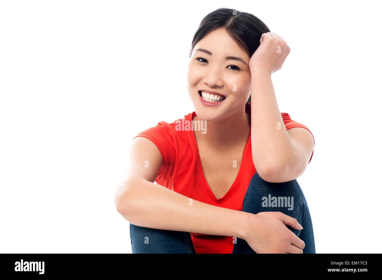 Relaxed young girl smiling while thinking something Stock Photo - Alamy