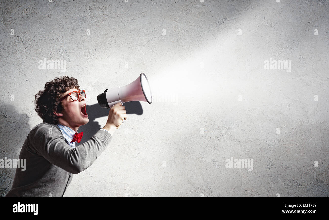 Young man with megaphone Stock Photo - Alamy