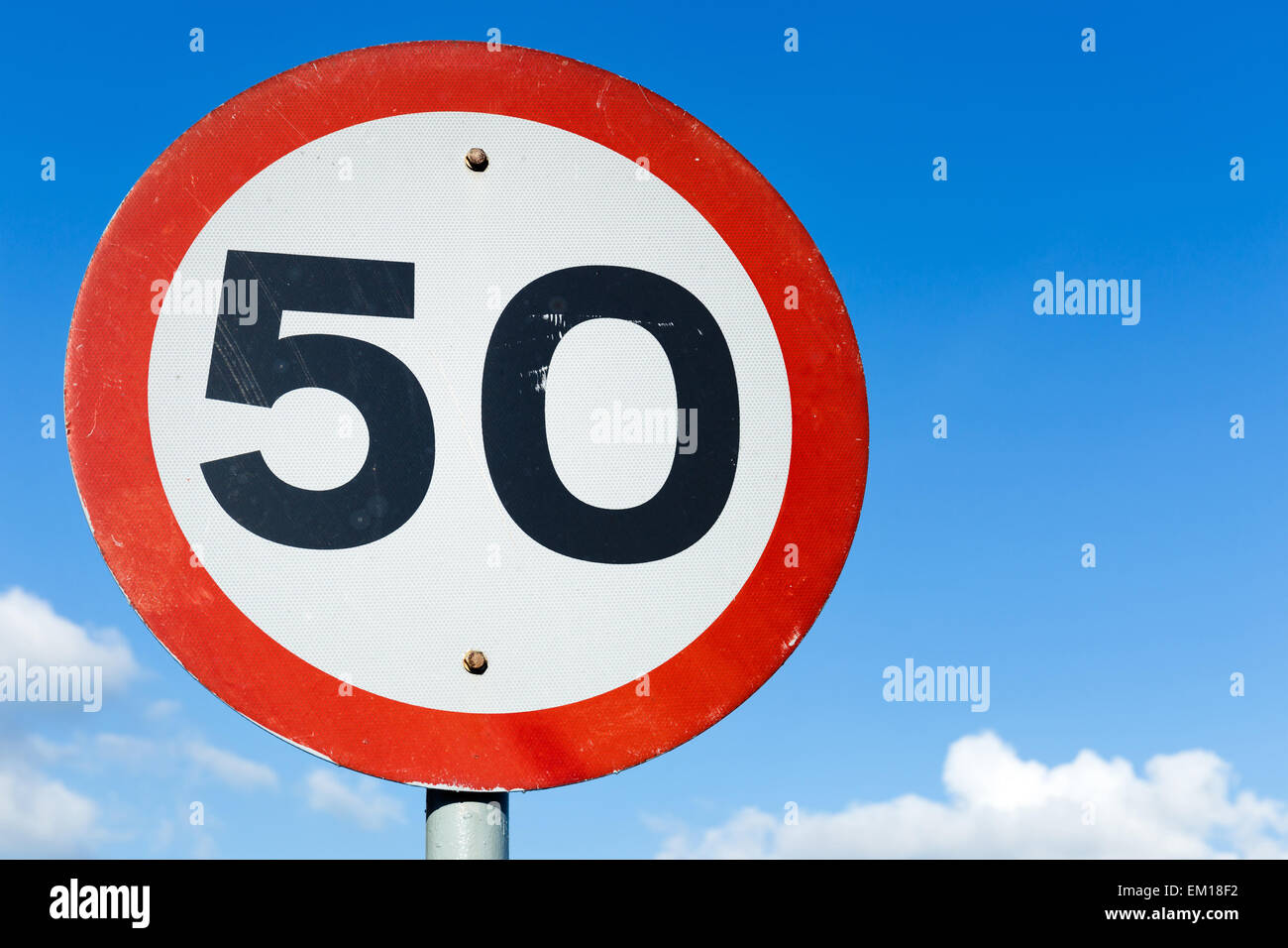 Road sign blue sky background Stock Photo - Alamy