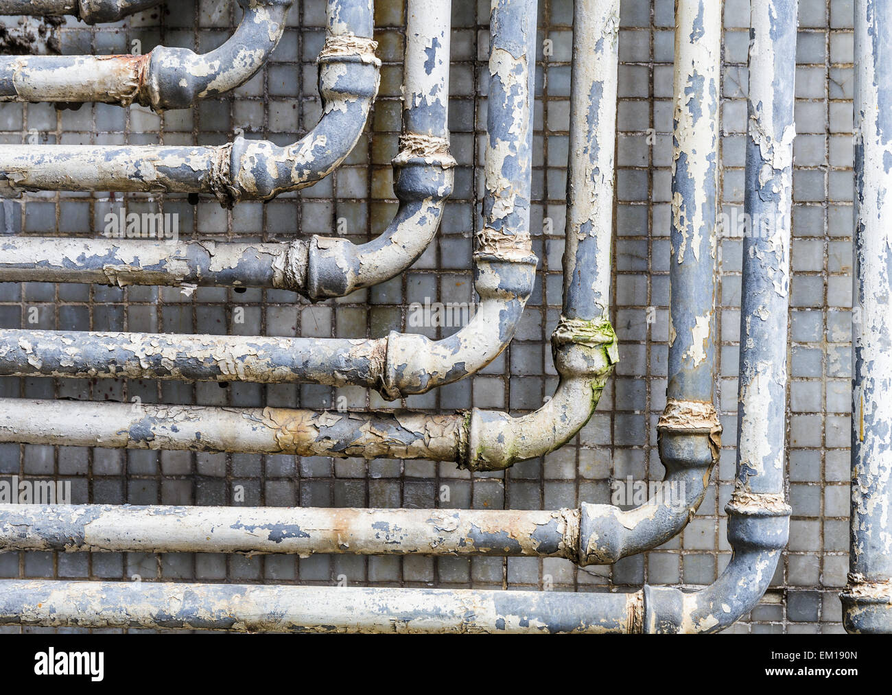 Series of parallel old pipes on wall Stock Photo - Alamy