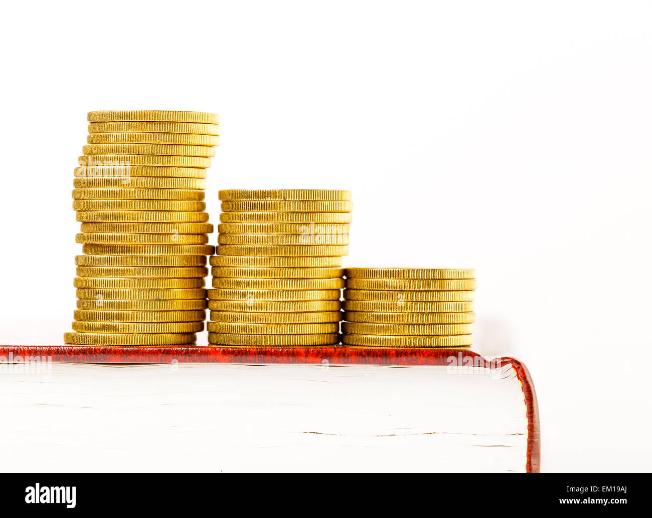 Money and book Stock Photo - Alamy