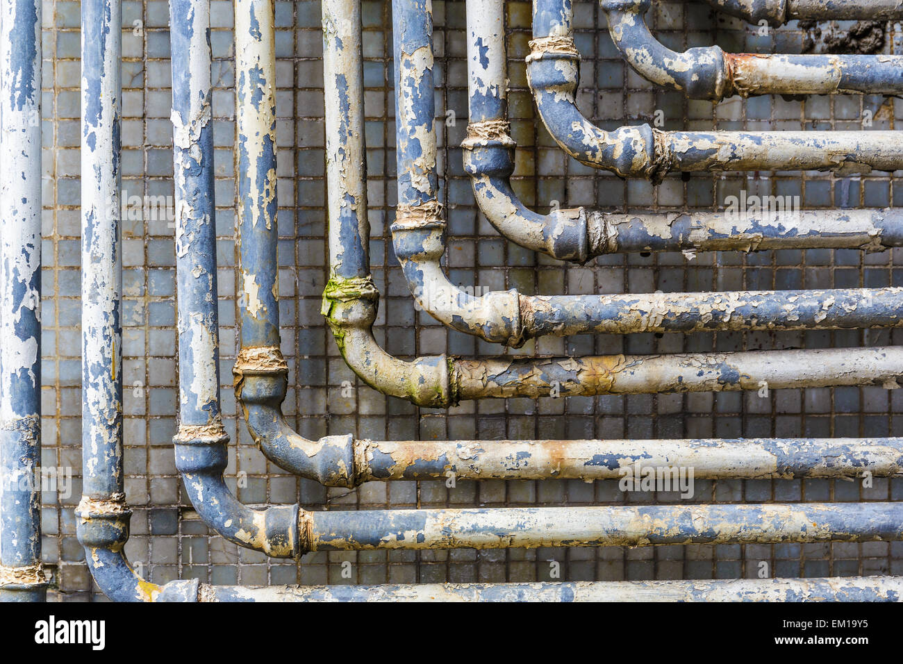 Series of parallel old pipes on wall Stock Photo - Alamy