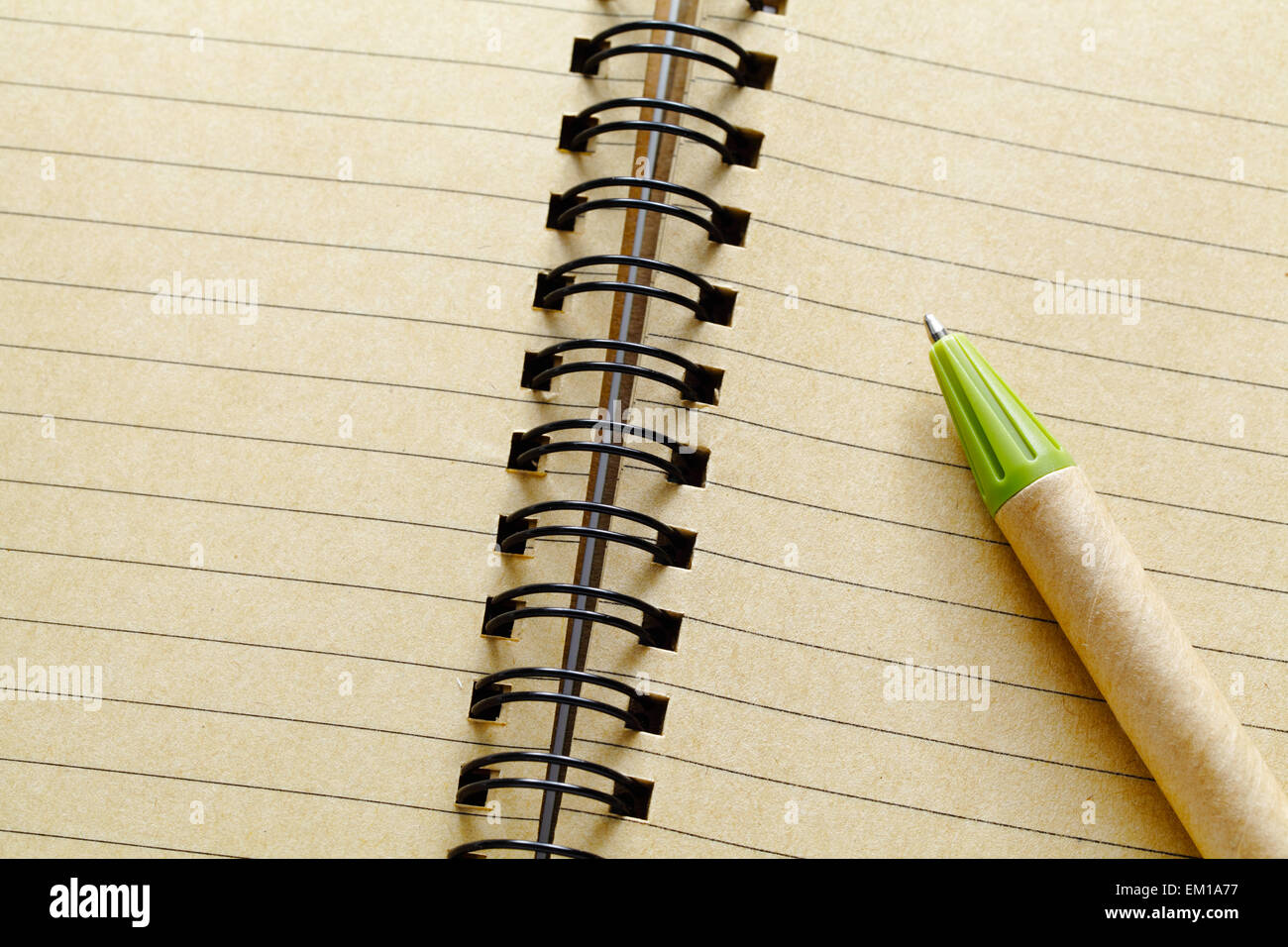 Spiral notebook and pen Stock Photo - Alamy