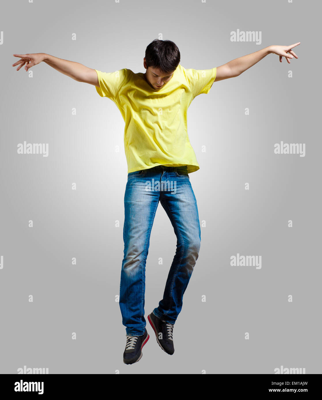 Young man dancing and jumping Stock Photo - Alamy