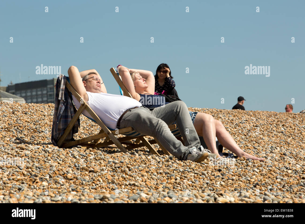 Sun worshipers sunning themselves on a scorching day at Brighton Beach ...