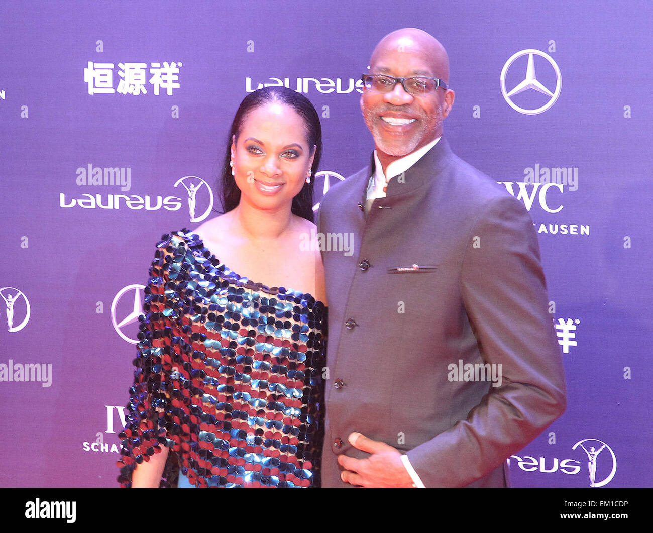 Shanghai. 15th Apr, 2015. Laureus chairman Edwin Moses (R) and his wife ...