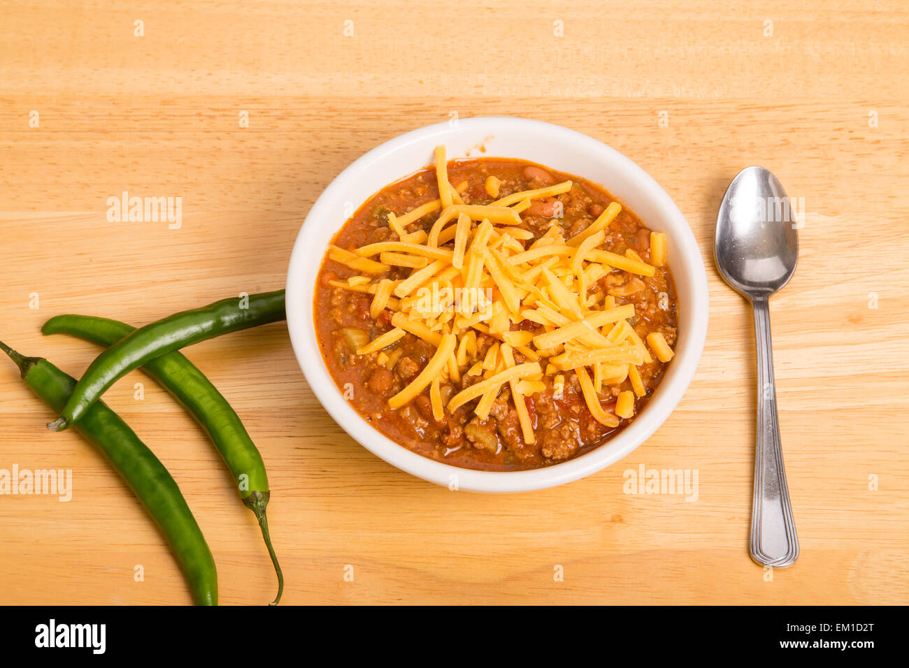 A bowl of chili con carne with beans and green chili peppers Stock ...