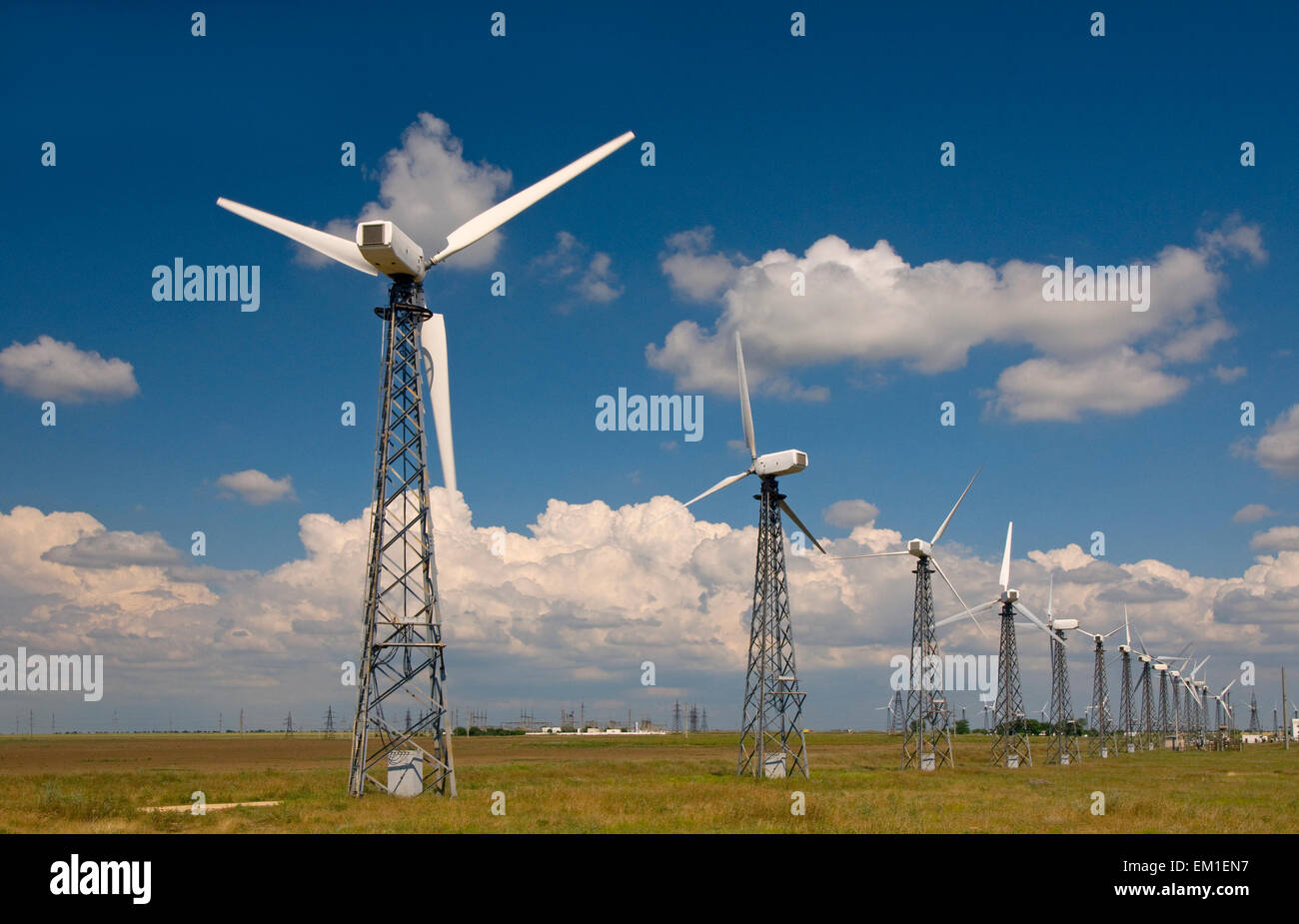 Wind farm against rural landscape. Blue sky with clouds are in the ...