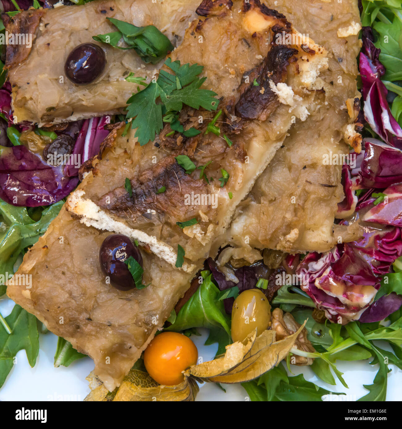 Classic french pissaladière, an onion tart, with a fresh local salad ...