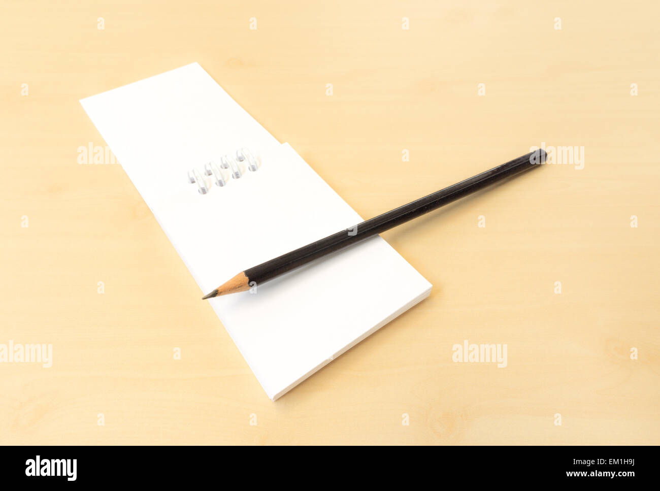 White Memo Note with Black Sharp Pencil on Wooden Surface Stock Photo ...