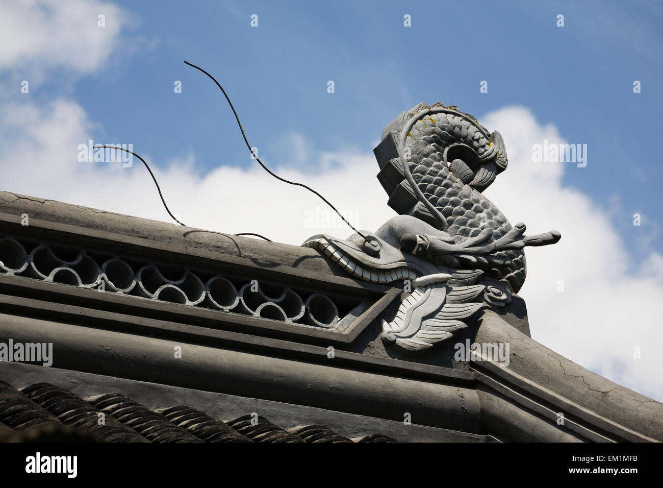 Sculpture Of A Dragonfish Eating The Roof Of A Building; Portland ...